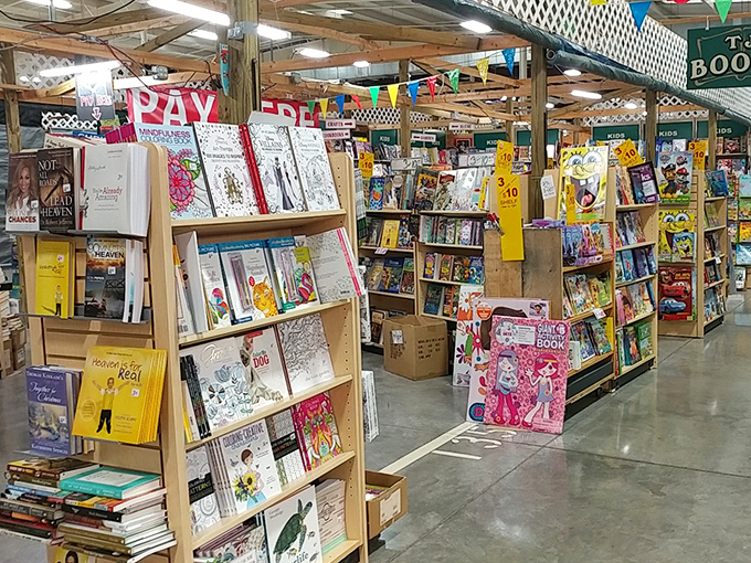 A bibliophile's dream come true&mdash;shelves stacked with everything from children's classics to regional cookbooks. The "PRAY" sign seems appropriate for those praying to find space for more books.