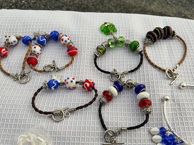 Handcrafted bracelets sparkle in the morning light. Each bead tells a different story, waiting to adorn wrists that appreciate second-hand charm.