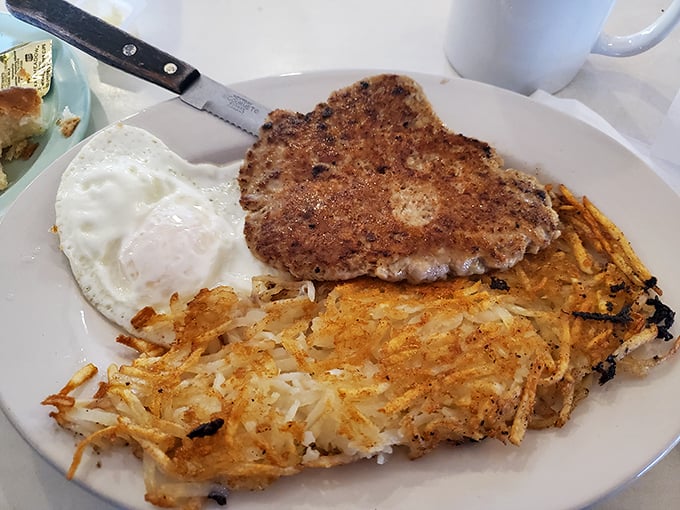 A proper country steak with eggs and hash browns that doesn't need fancy plating to tell you it's serious about flavor.