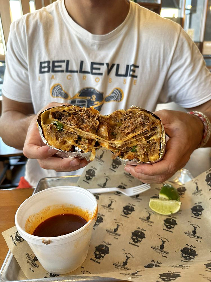 The cheese pull on this quesabirria would make a pizza commercial jealous. That consom&eacute; cup is liquid gold for dipping.