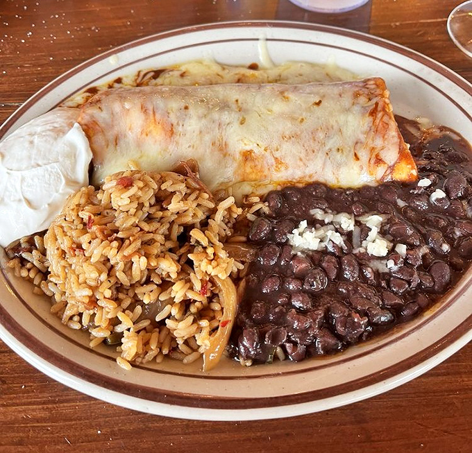 This isn't just a burrito &ndash; it's architecture. The melted cheese blanket tucked over beans and rice makes for comfort food that hugs you back.