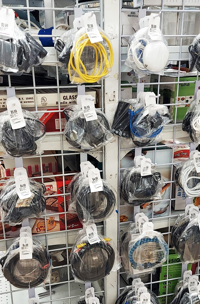 A wall of technological history, neatly packaged in plastic. Someone's abandoned HDMI cable is about to become another person's connection to happiness.