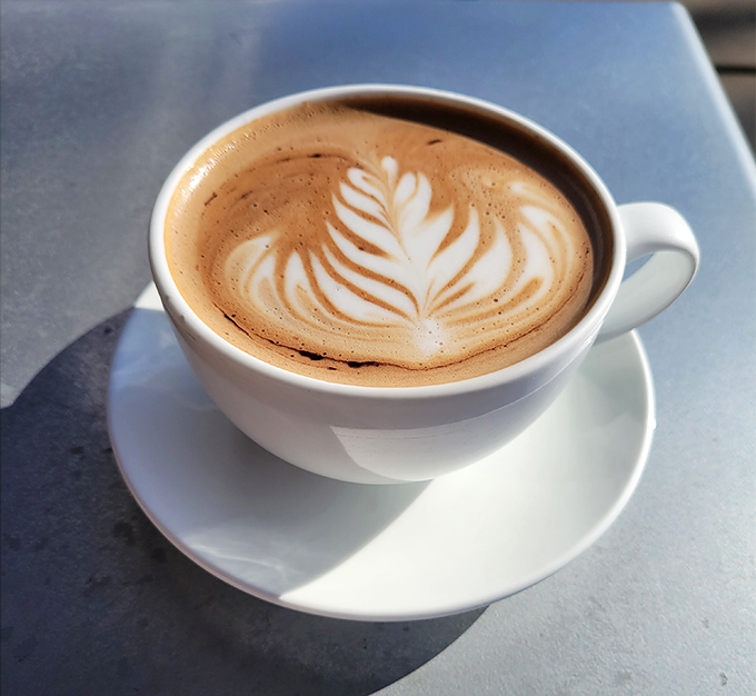 Latte art so pretty you almost don't want to drink it. Almost. That leaf pattern deserves its own Instagram account.