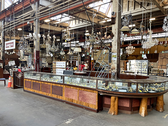 Crystal chandeliers dangle like elegant jewelry above a vintage display counter, where yesterday's craftsmanship meets today's design sensibilities.