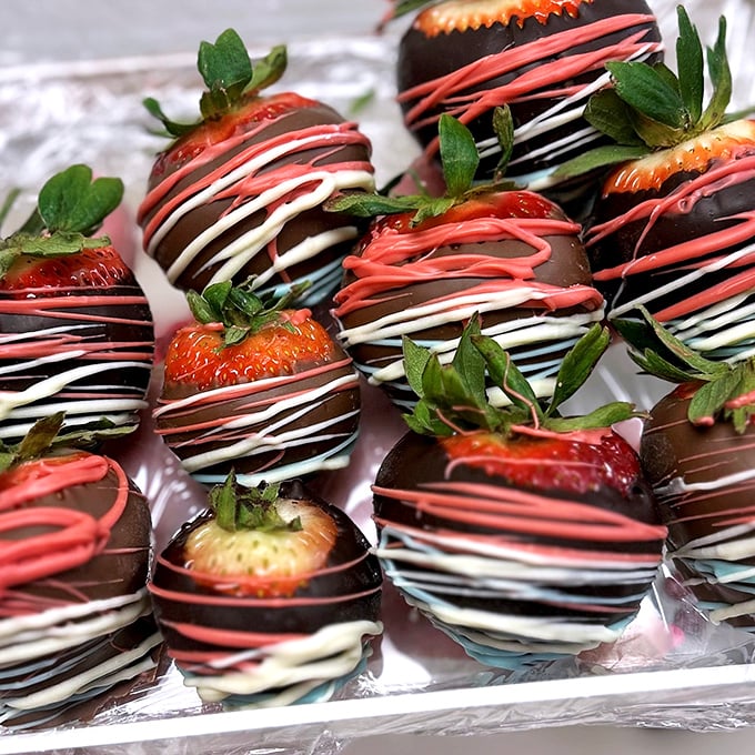 Strawberries playing dress-up in their chocolate finest. These berries didn't just get dipped&mdash;they got the full red-carpet treatment with those elegant drizzles.