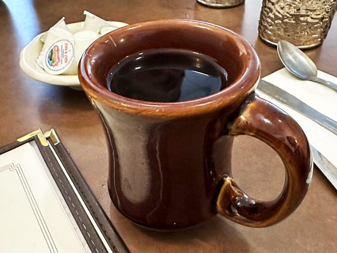 Sunlight streams through blinds into a dining room where countless birthdays, anniversaries, and "just because" meals have been celebrated over decades. 