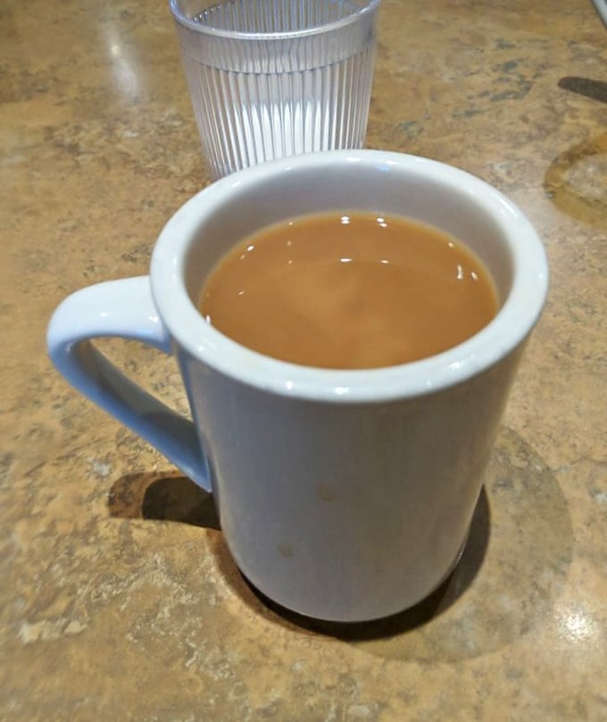 Coffee in a diner mug &ndash; no foam art, no fancy bean origin story, just the kind of honest brew that's fueled American conversations for decades.
