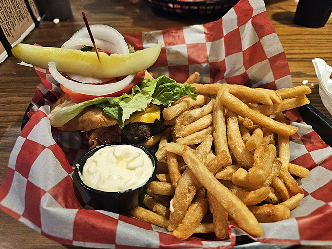 This isn't just a burger; it's an engineering marvel of beef, toppings, and structural integrity that dares you to find its entry point.