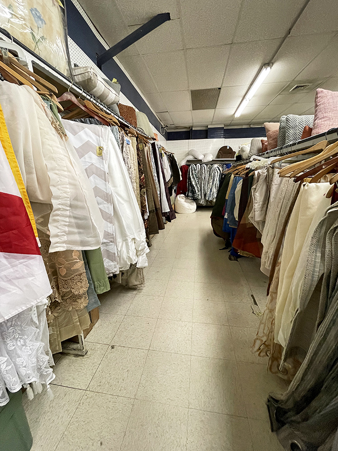 The linens aisle: where vintage curtains and tablecloths whisper tales of dinner parties and window views from decades past.