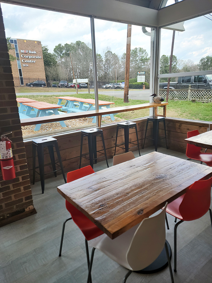 The dining area offers a front-row seat to Durham life passing by. Simple wooden tables that have hosted countless "Oh my God, you have to try this" moments.