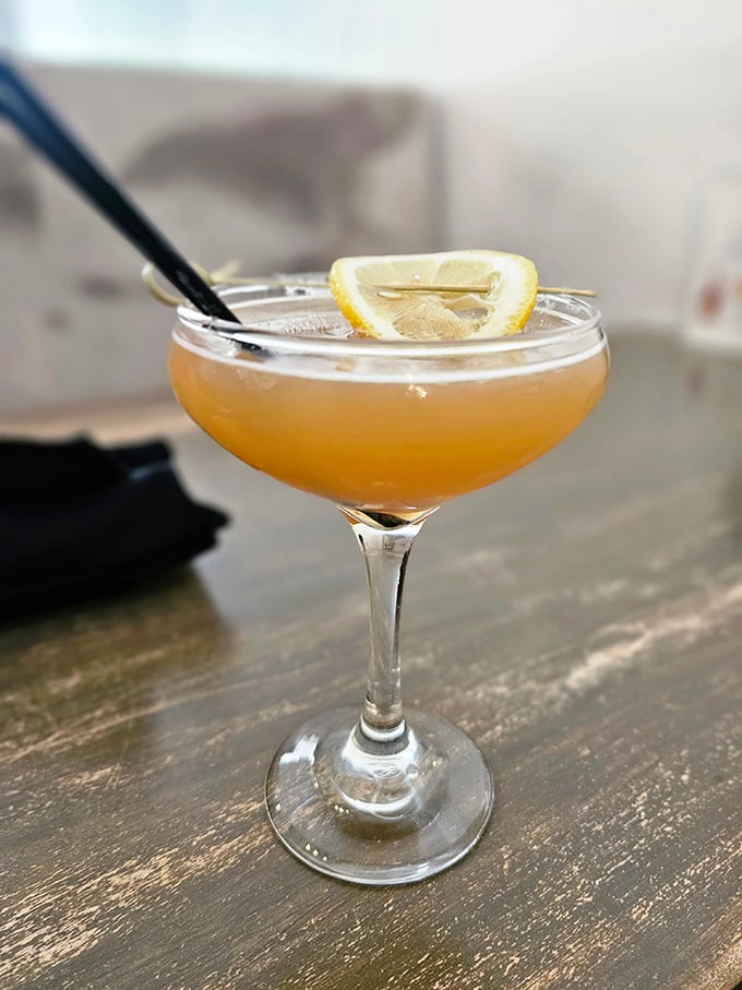 A cocktail that whispers "vacation" with every sip &ndash; the lemon garnish isn't decoration, it's the exclamation point on a liquid smile.