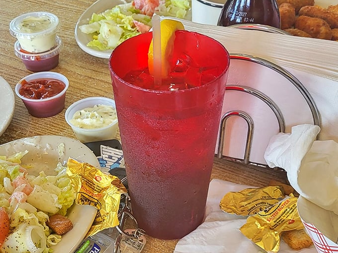 That crimson drink isn't just refreshing&mdash;it's the perfect counterpoint to a seafood feast, like a sunset in a glass.