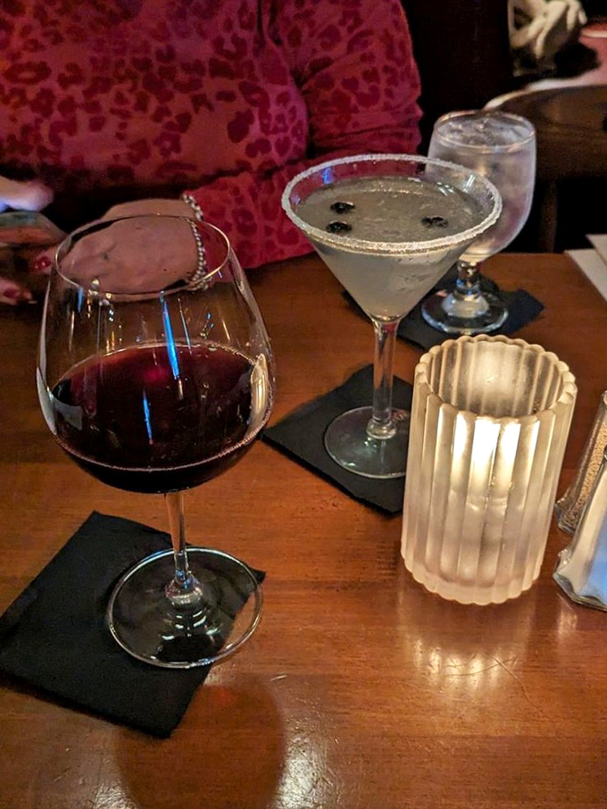 The perfect steakhouse pairing: a robust red wine alongside a martini that's colder than your ex's heart but infinitely more satisfying.