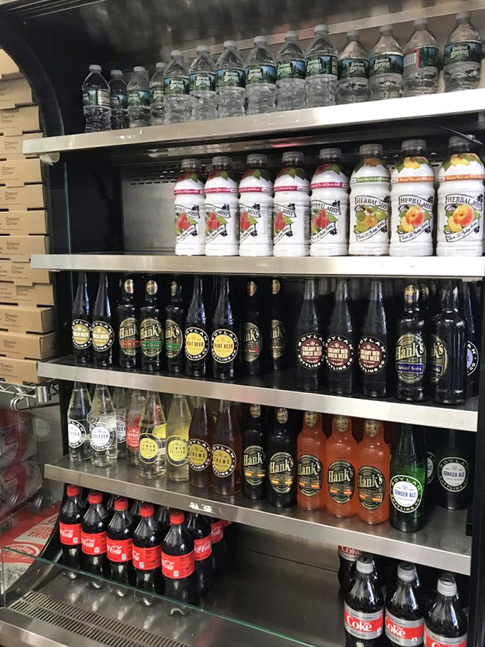 The beverage cooler of champions. A selection of sodas and waters standing by, ready to help you navigate the glorious richness of your impending sandwich adventure.