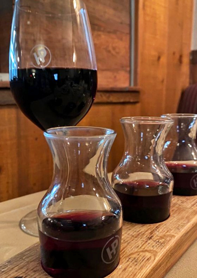 Their house wines arrive in charming carafes, ready to perform the perfect supporting role to your oak-grilled masterpiece.