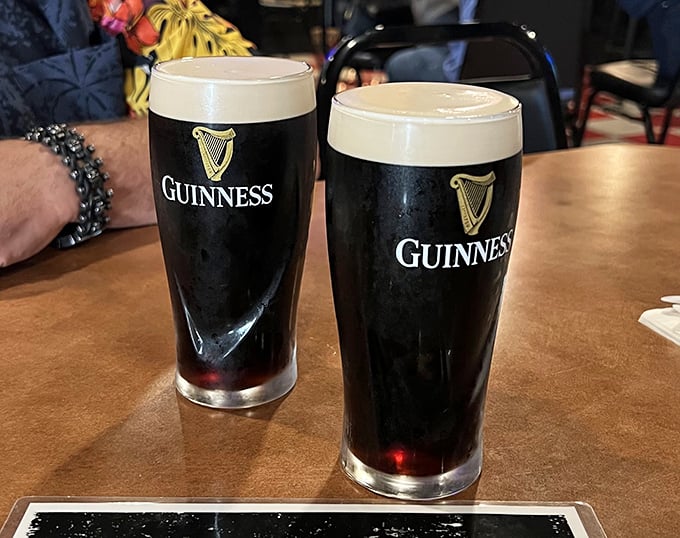 Two pints of Guinness standing at attention &ndash; because nothing complements British fish and chips like Ireland's most famous export.