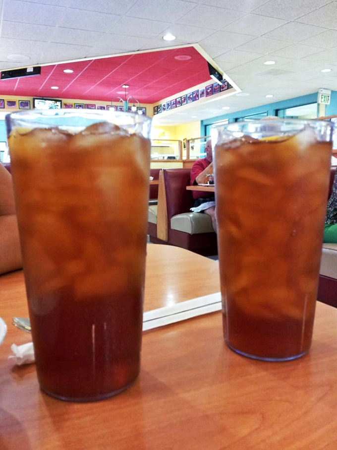 Ice-cold beverages served in proper glasses because even the drinks deserve respect at this neighborhood treasure.