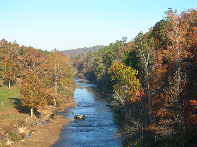 The Buttahatchee River in autumn glory&mdash;where Mother Nature shows off her color coordination skills better than any interior designer.