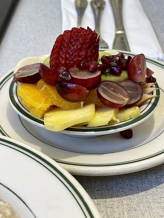 A fruit bowl that actually looks like someone cares&mdash;vibrant strawberries, grapes, and pineapple that weren't just scooped from a plastic tub.