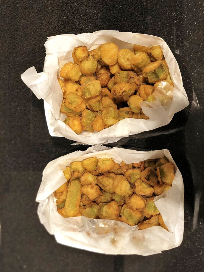 Fried okra: turning vegetable skeptics into believers one crispy, cornmeal-coated bite at a time. Green never tasted so sinful.