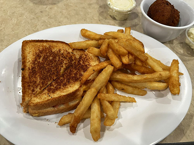 The humble grilled cheese, elevated to art form with perfectly golden bread and melty cheese that stretches with each bite.