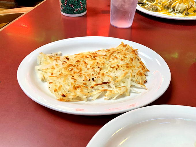 Hashbrowns that have achieved the impossible: perfectly crisp edges with a golden-brown surface that makes breakfast worth waking up for.