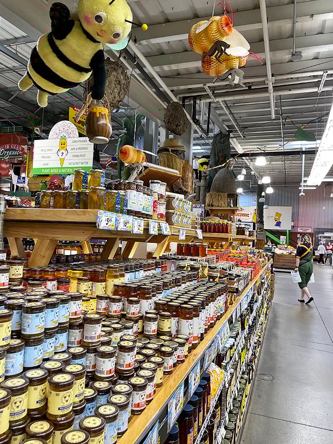 Honey heaven! Giant plush bees hover protectively over jars of liquid gold, while shelves below showcase enough varieties to make Winnie the Pooh relocate to Ohio.