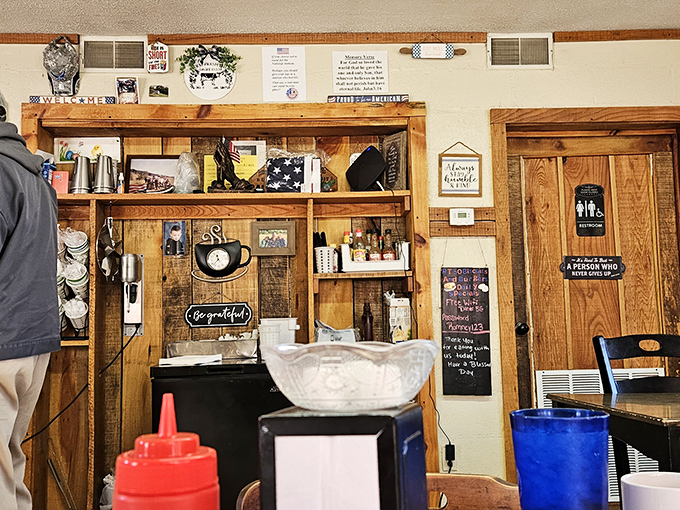 Wooden signs like "Bless the Cook" adorn the walls&mdash;not as decoration, but as instructions to be taken very seriously after your first bite.