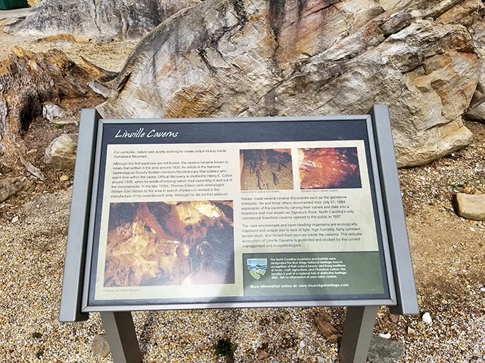 History etched in stone and shared on signage—where curious minds gather before descending into North Carolina's subterranean treasure.