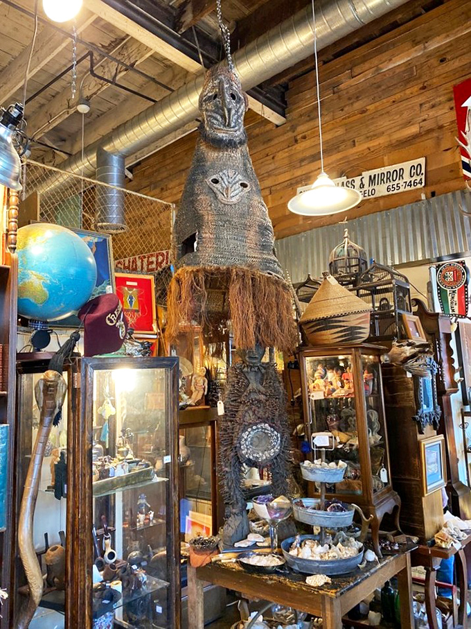 That tribal mask hanging from the ceiling isn't just decor&mdash;it's the store's unofficial guardian, keeping watch over treasures from seashells to globes to vintage display cases.