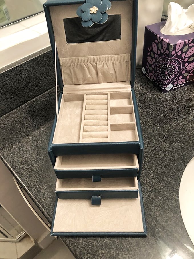 Not just a jewelry box, but a portable vault of possibilities. With those multiple drawers, you could organize everything from earrings to the evidence of your secret candy addiction.