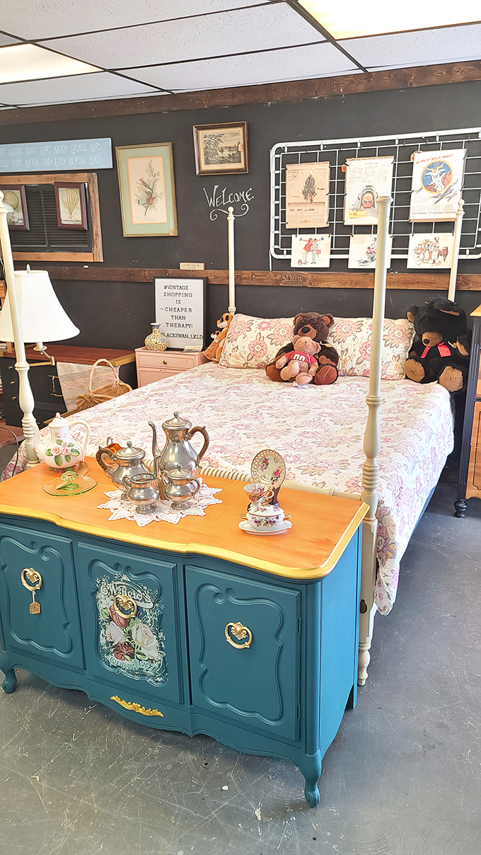 "Vintage shopping is cheaper than therapy" proclaims the sign, while teddy bears lounge on a bed that's seen decades of dreams.