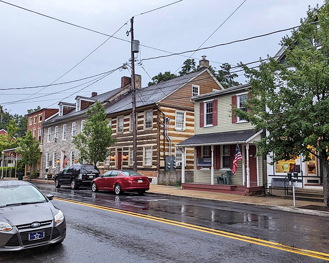 Rain-slicked streets reflect the colorful history of Lititz, where log cabins stand shoulder-to-shoulder with brick townhomes in a timeline of American architecture.