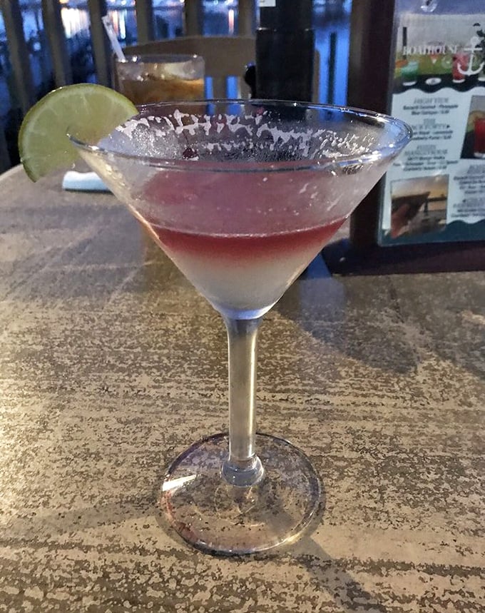 A martini that looks like Florida sunset in a glass. This isn't just a drink; it's the liquid equivalent of vacation permission slips for adults.