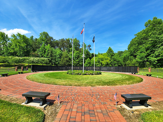 This memorial park creates a peaceful space for reflection, where brick pathways and American flags honor sacrifices made for freedom.