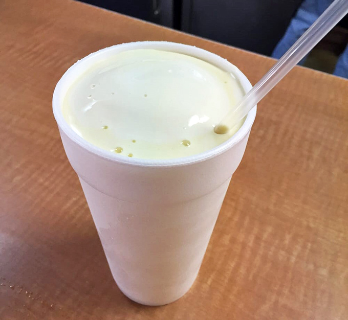 This vanilla milkshake isn't just thick&mdash;it's contemplating a career in solid geometry. The straw stands at attention, awaiting your worthy effort.