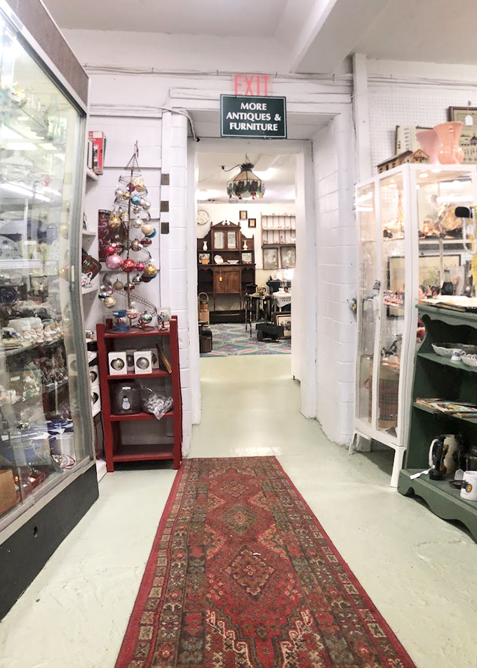 The sign promises "MORE ANTIQUES & FURNITURE" as if the first several thousand items weren't enough to keep you browsing until closing time.