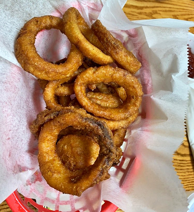 Golden onion rings with the perfect crunch-to-tenderness ratio. These aren't just sides&mdash;they're supporting actors worthy of their own spotlight.