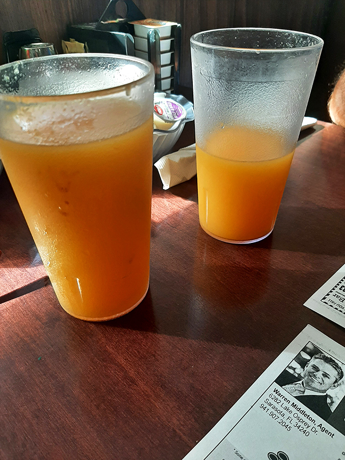 Fresh orange juice so vibrant it practically glows, proving sometimes simple pleasures are the most satisfying.