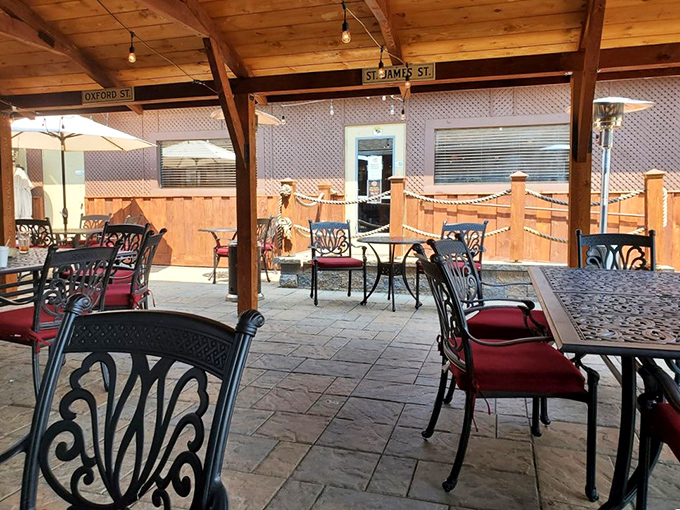 The outdoor patio offers a different kind of maritime experience. Red cushions on wrought iron chairs create a perfect perch for summer dining.