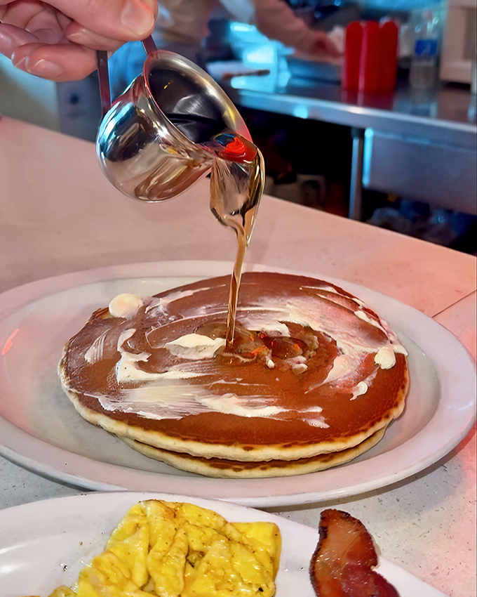 The ceremonial pouring of maple syrup onto golden pancakes&mdash;a morning ritual as sacred as the first cup of coffee.
