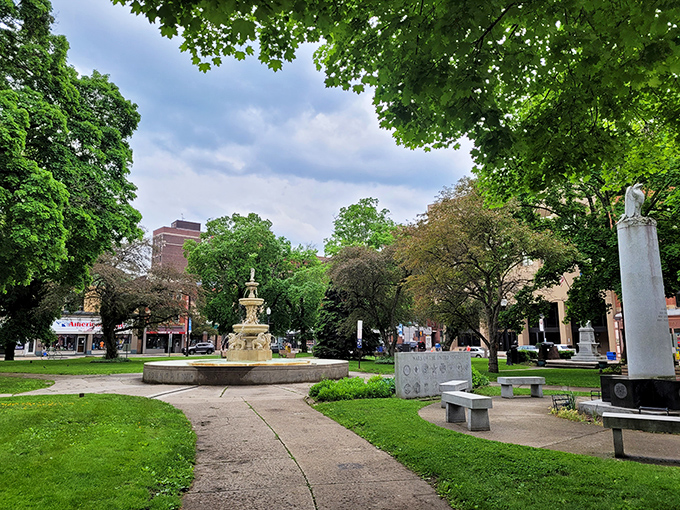 Central Park provides an urban oasis where residents gather, relax, and connect. The fountain creates a soundtrack for afternoon contemplation.