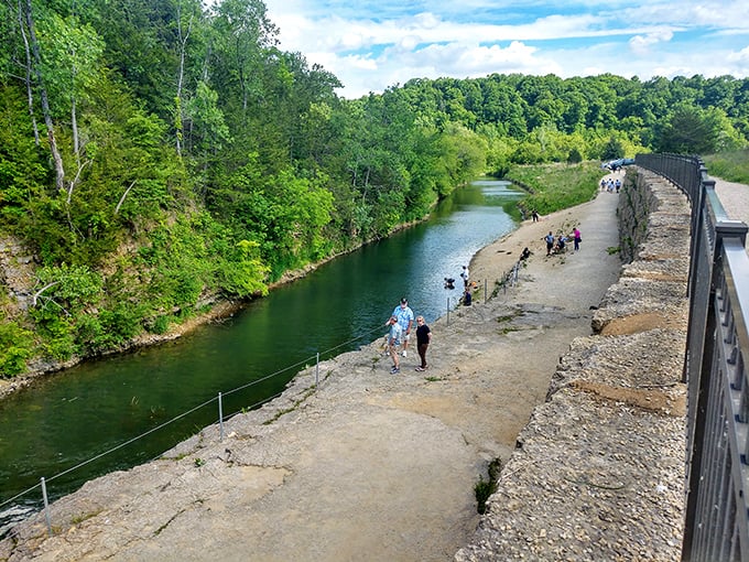 Riverside promenade where visitors stroll between limestone walls and flowing waters, proving Illinois has more dramatic landscapes than most travel guides let on.