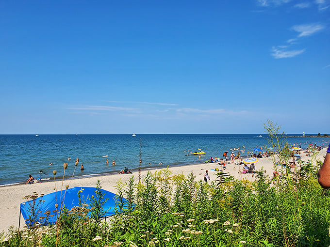 Summer's perfect equation: golden sand + blue water + colorful umbrellas = memories that last long after the sunburn fades.