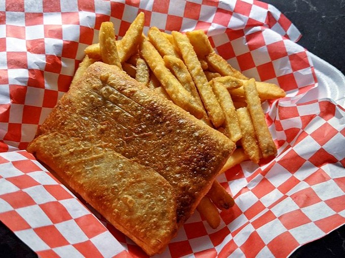 The pizza puff&mdash;Chicago's answer to the empanada&mdash;golden-fried and ready to challenge your notion of what belongs with fried chicken.