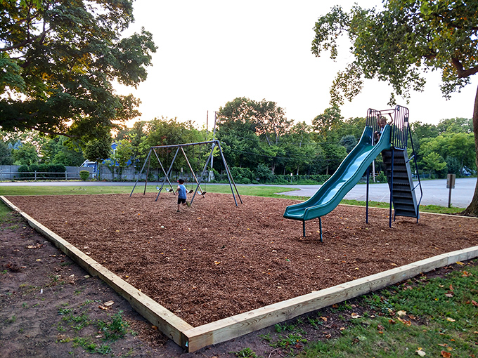 Even paradise needs a playground! Little explorers take a break from beach-combing to conquer slides and swings under Catawba's shady trees.
