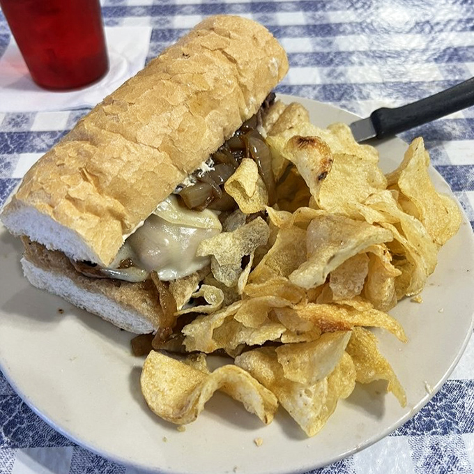 This po'boy isn't poor in flavor &ndash; a crusty French bread vessel loaded with savory fillings and a mountain of chips for good measure.