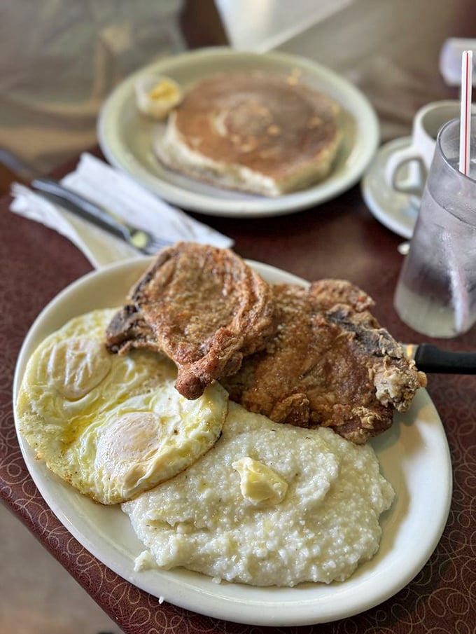 Pork chops cooked to perfection alongside creamy grits and sunny-side-up eggs &ndash; the breakfast equivalent of winning the lottery.