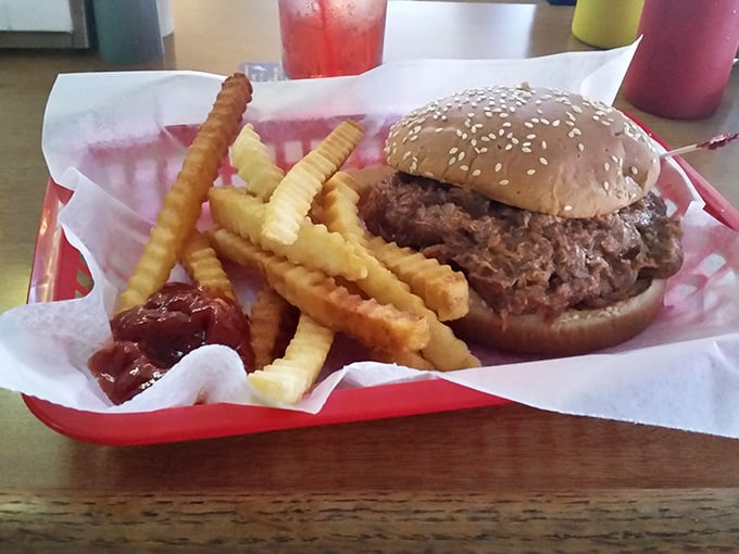 Not all heroes wear capes&mdash;some come on sesame seed buns. This pulled pork masterpiece with crispy fries makes Monday feel like Saturday.