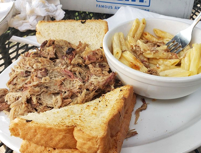 When pulled pork is this tender, the bread becomes merely a delivery system. That side of pasta salad is just keeping things civilized.